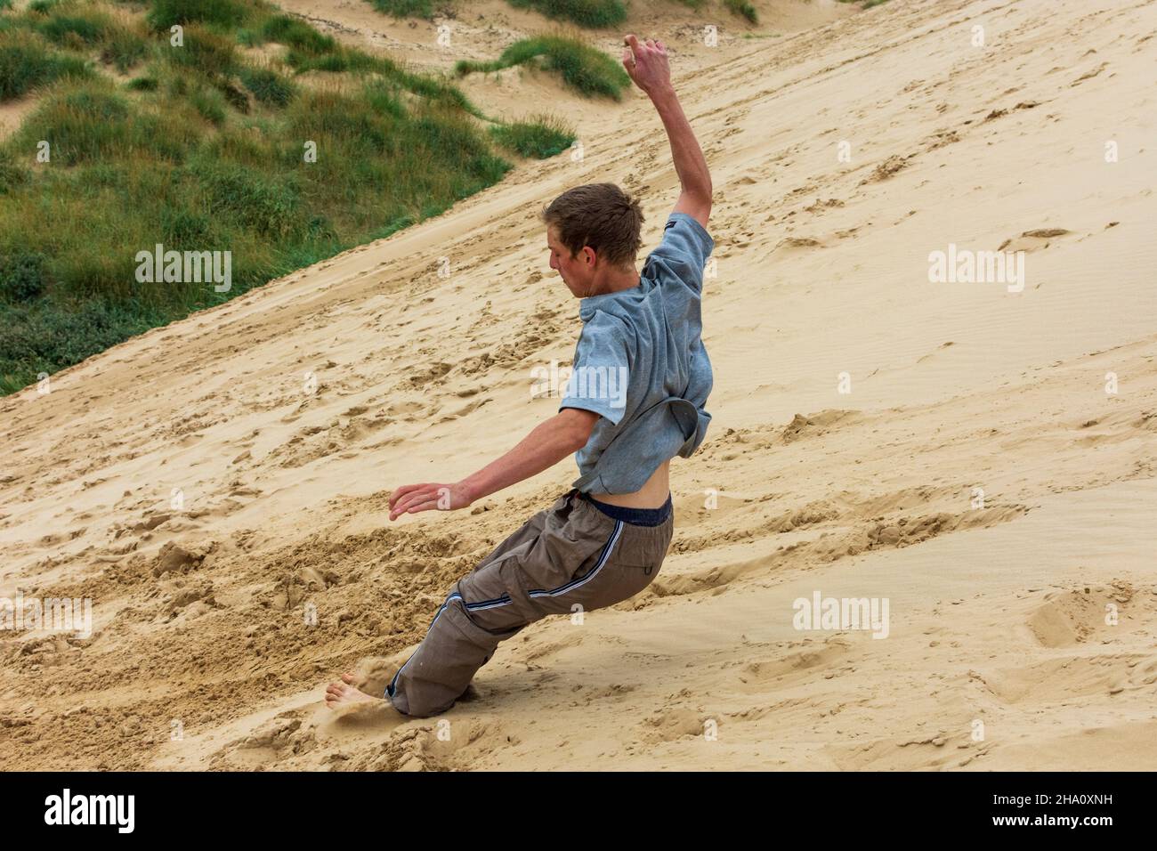 Sliding down sand dune hi-res stock photography and images - Alamy
