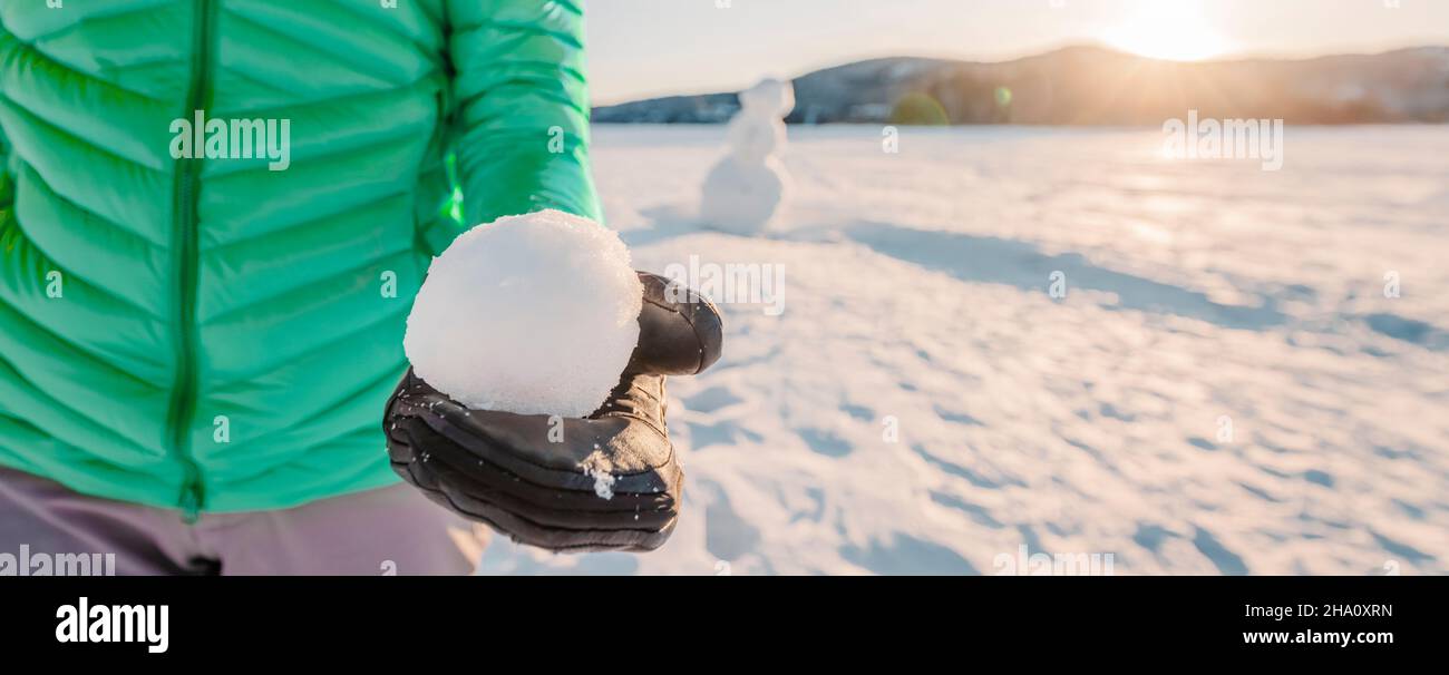 Winter snowball fight concept outdoors. Girl holding snowball on snowy ...