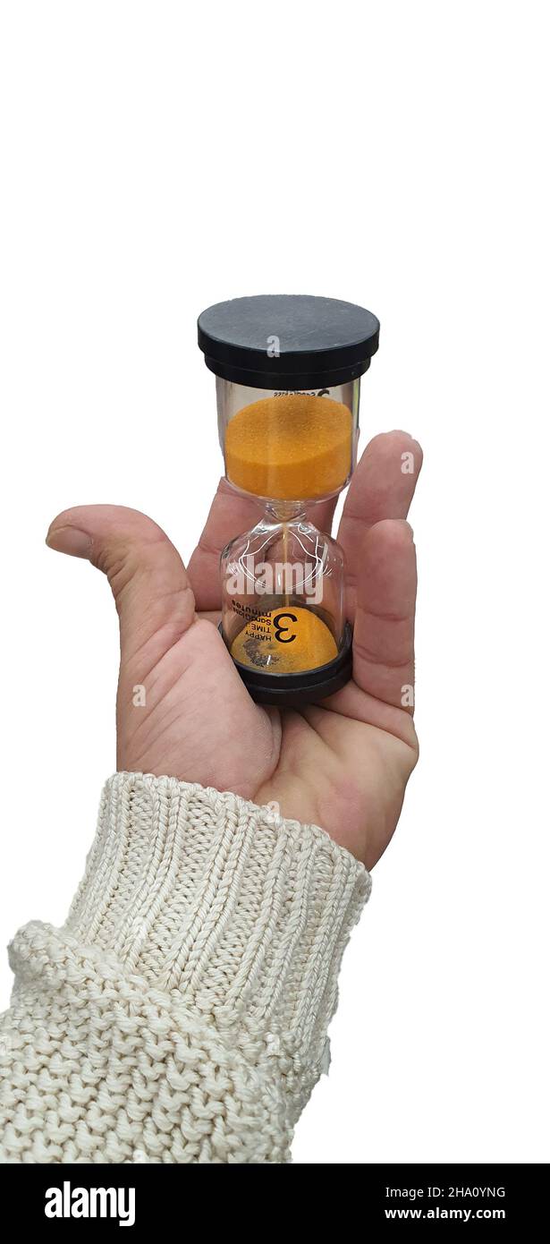 Hand holding an hourglass isolated on white background Stock Photo - Alamy