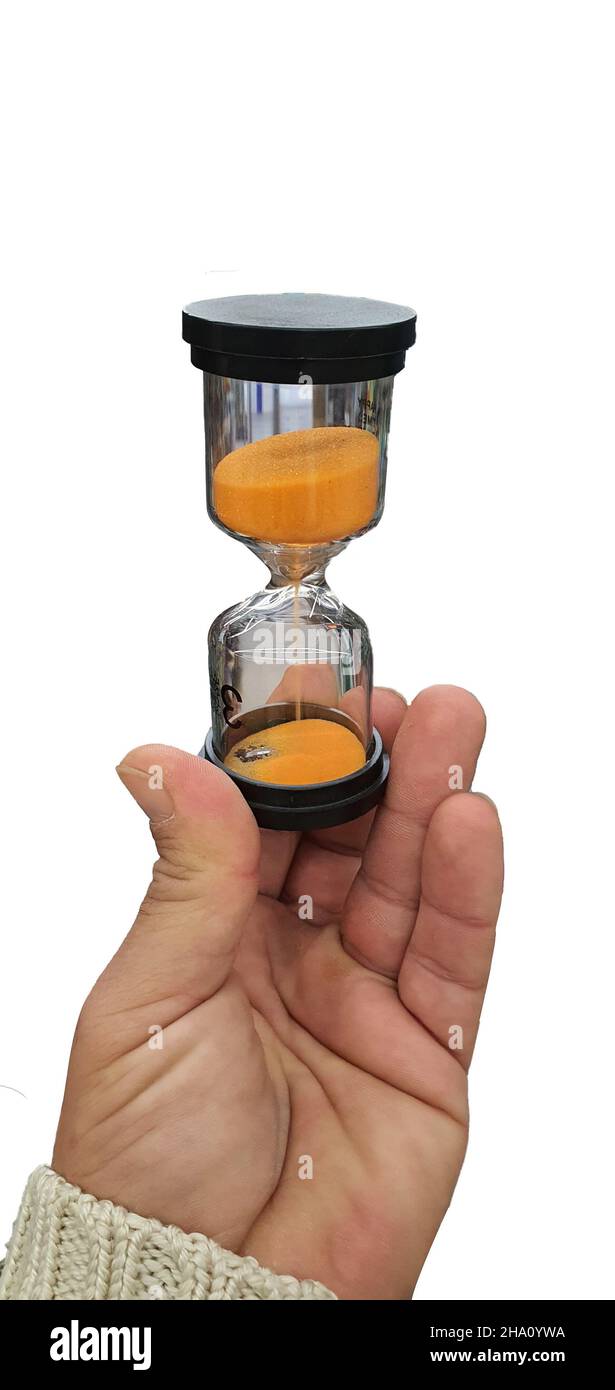 Hand holding an hourglass isolated on white background Stock Photo - Alamy