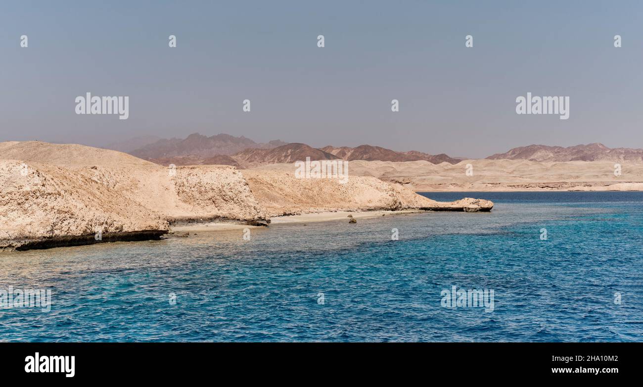 Beautiful seascape with a hilly coastline as a natural backdrop. Nature ...