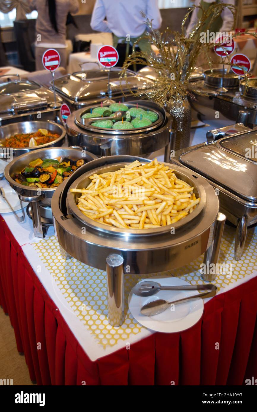 french fries on the table in a restaurant Stock Photo - Alamy
