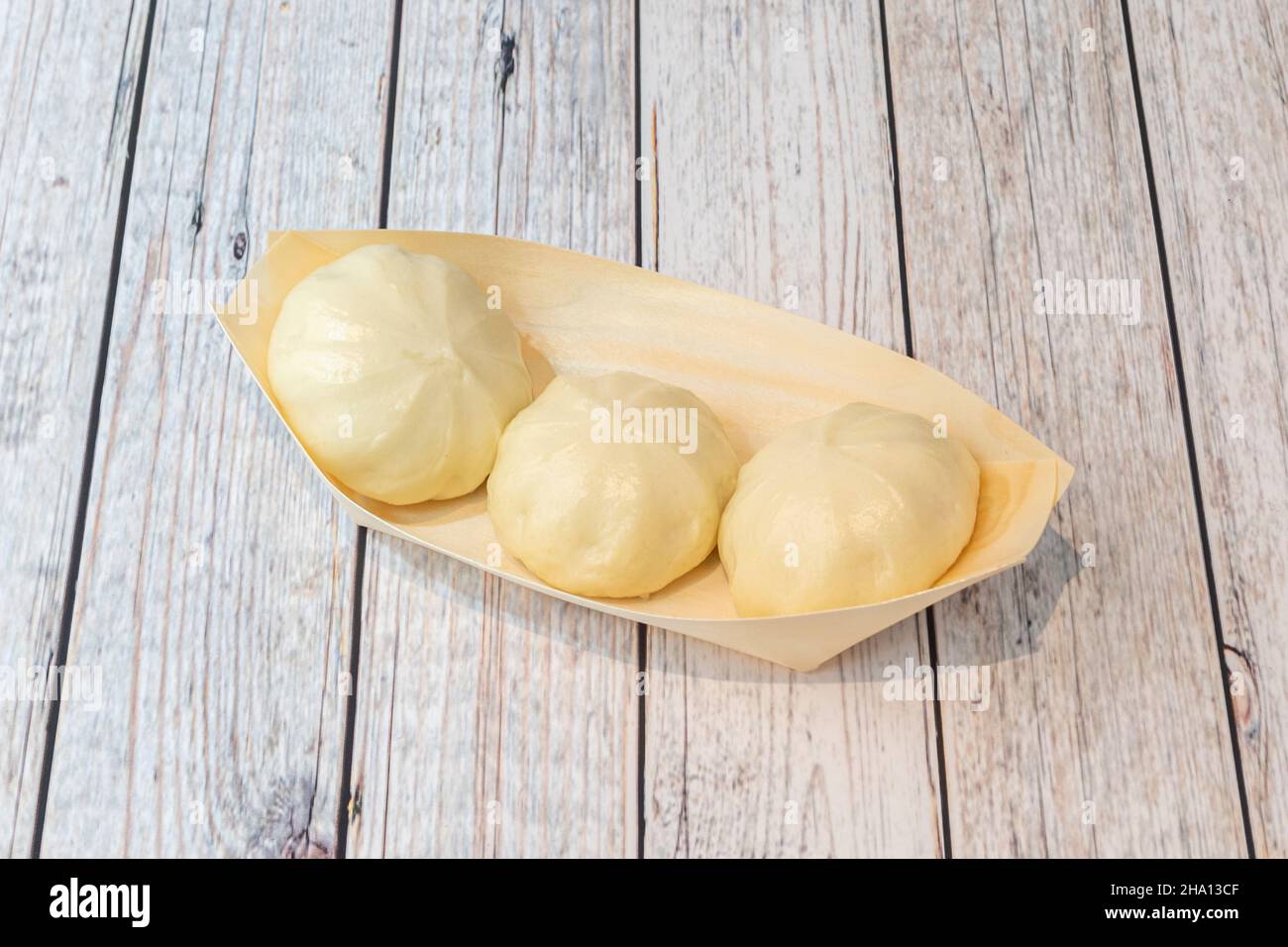 Baozi, or simply bao, bau or min pao, is a type of stuffed bun or bread ...