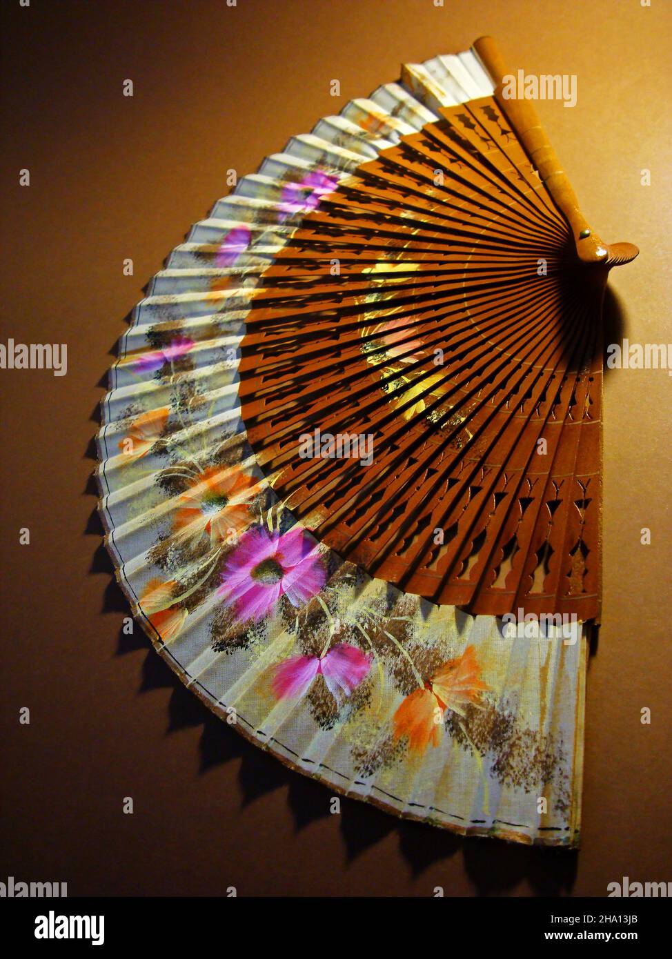 Authentic Spanish Fan on brown background Stock Photo - Alamy
