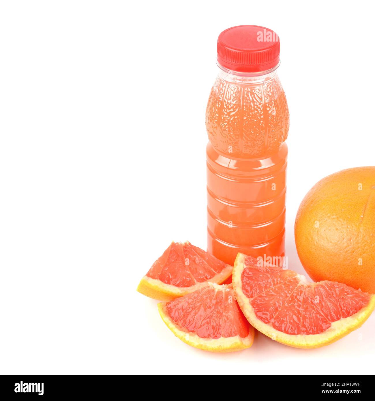 A fruit of grapefruit and a bottle with juice isolated on white ...
