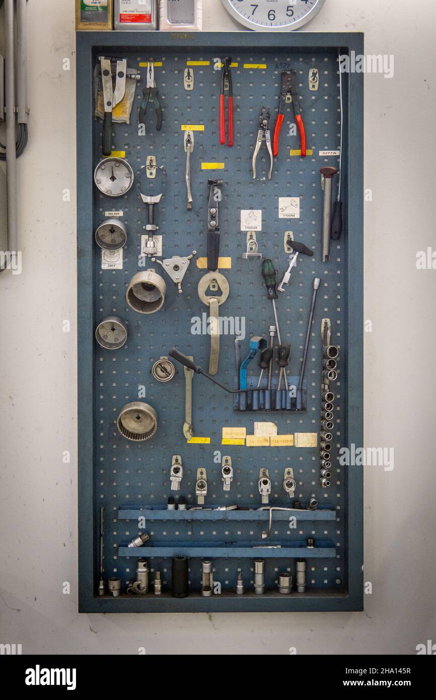 Professional work tools hanging on steel wall as background hi-res ...