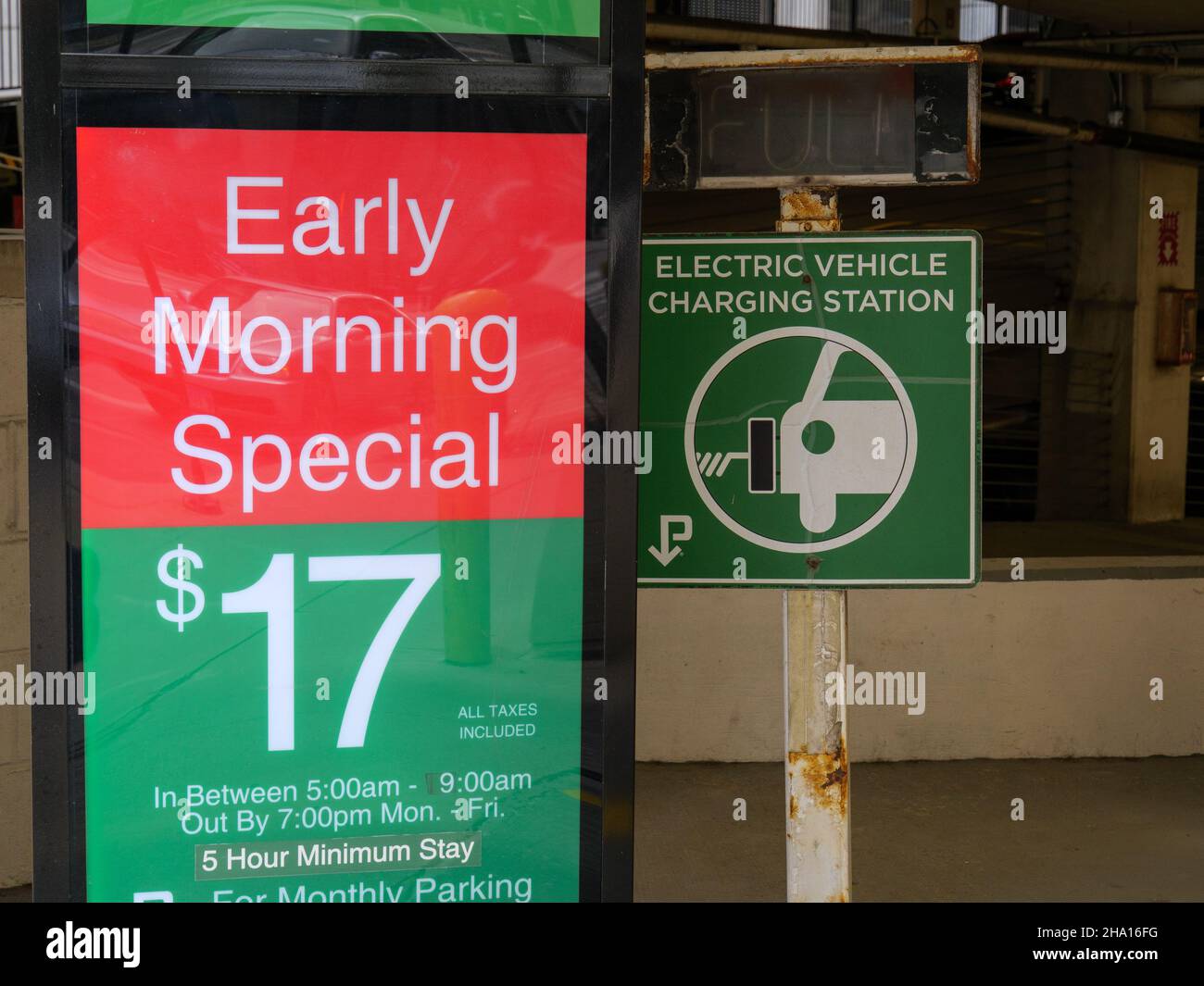 EV charging station sign at parking garage. Chicago, Illinois Stock ...