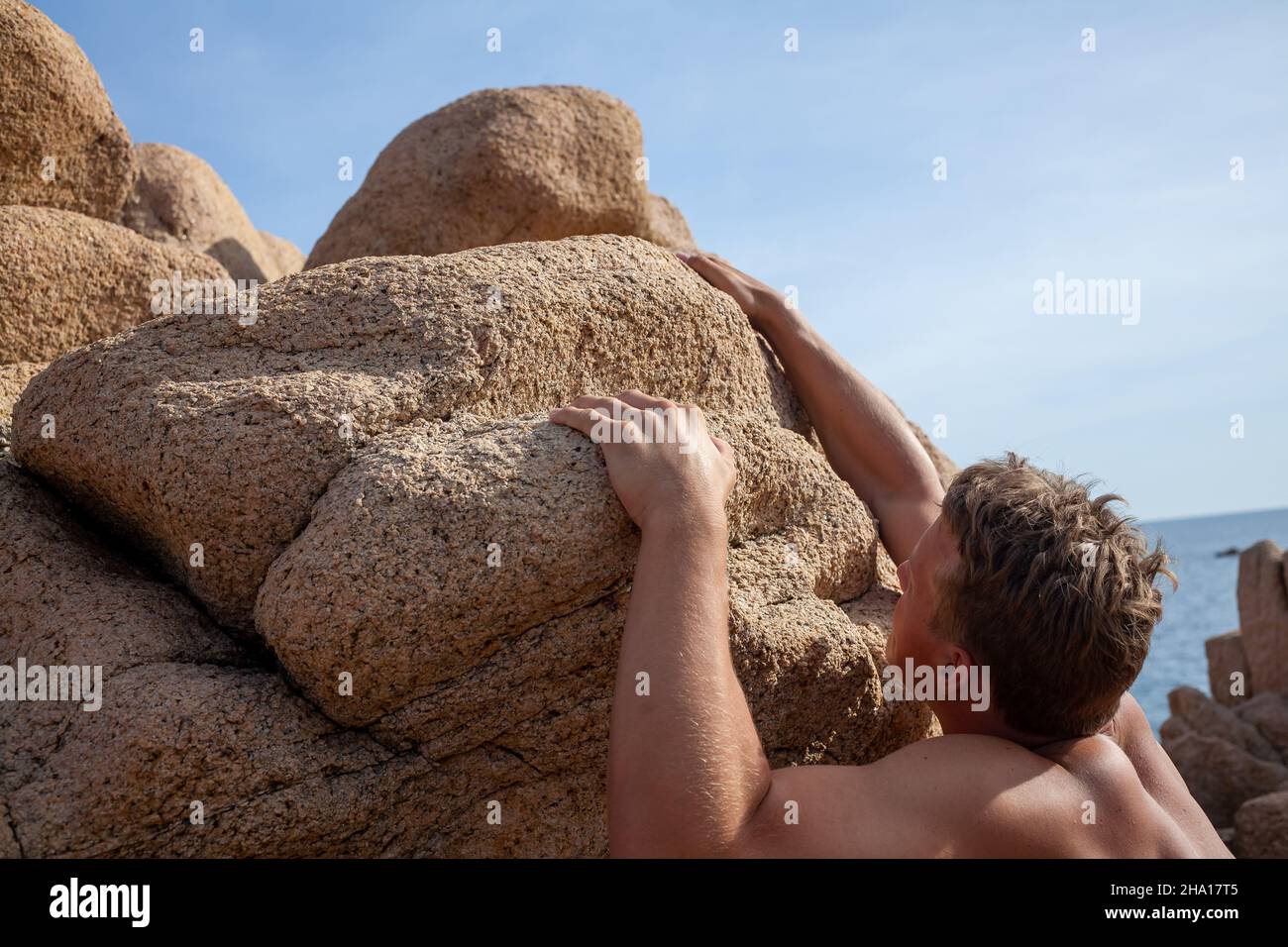 Man rock climbing up mountain hi-res stock photography and images - Alamy