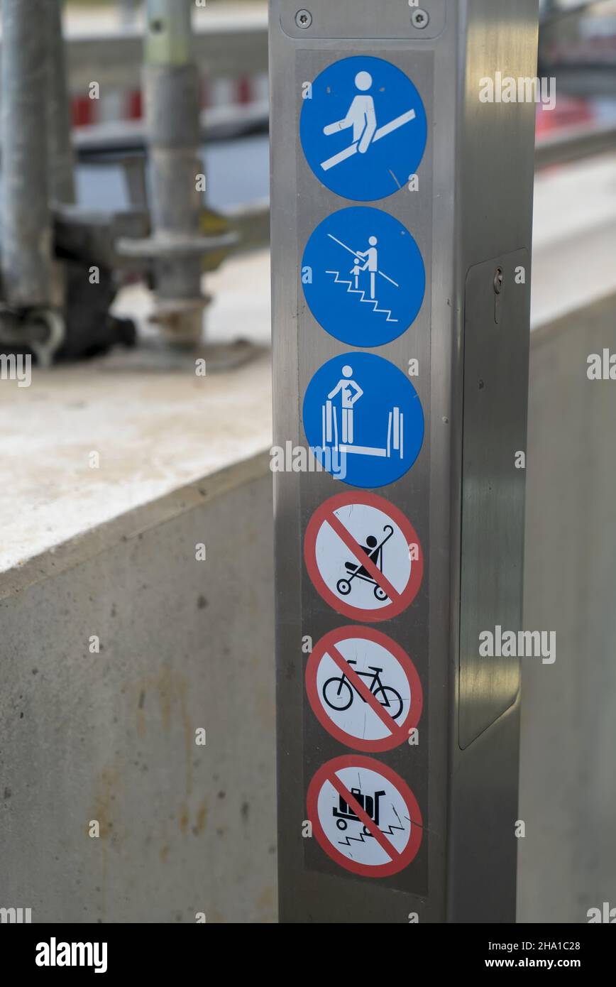 Sticker signs on the escalator Stock Photo - Alamy