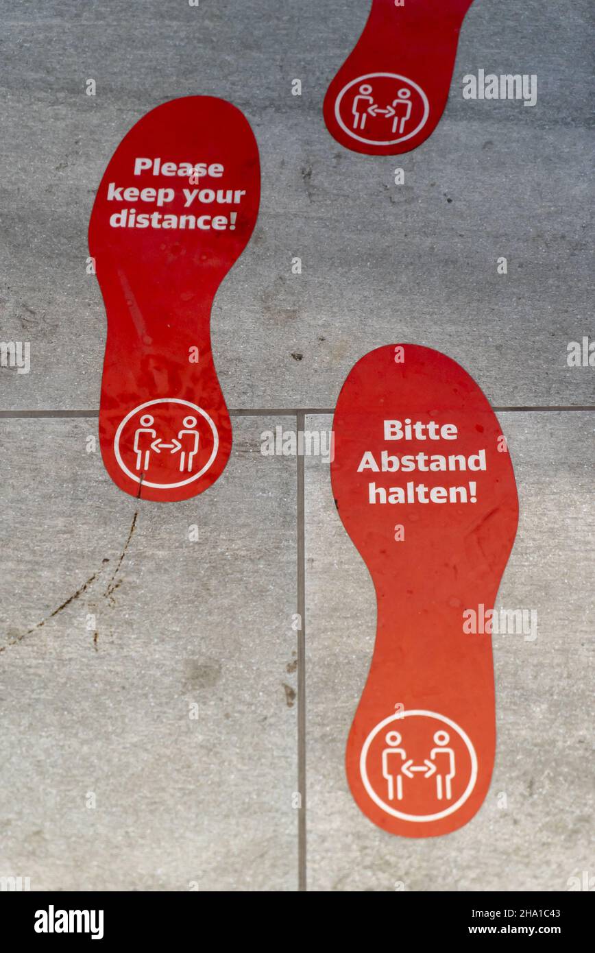 "keep the distance" foot red signs on the streets of Germany Stock ...