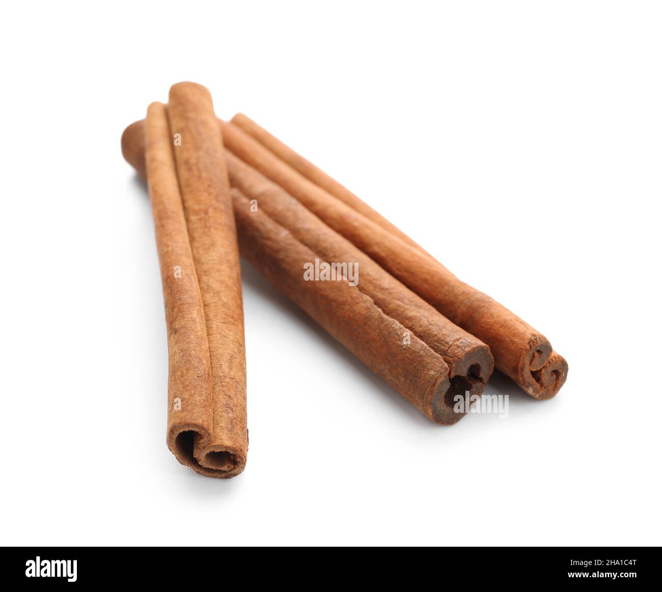 Natural cinnamon sticks on white background Stock Photo - Alamy