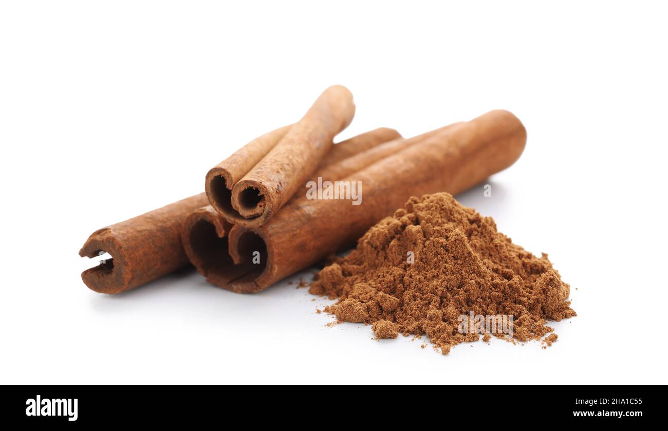 Natural cinnamon sticks and powder on white background Stock Photo - Alamy