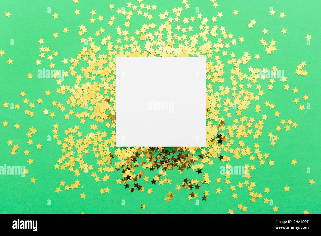 Blank card and beautiful golden confetti on color background Stock ...