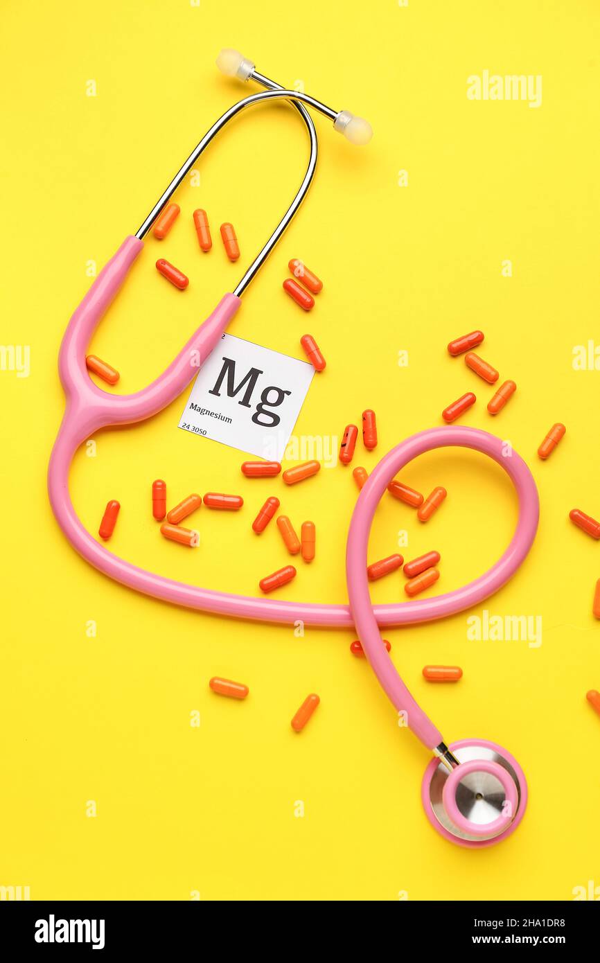 Magnesium pills and stethoscope on yellow background Stock Photo - Alamy