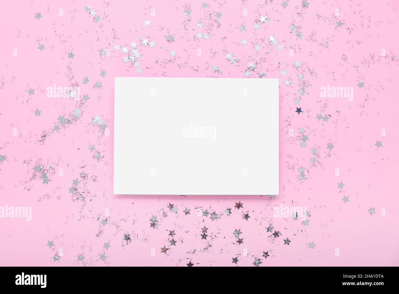 Sheet of paper and beautiful confetti on pink background Stock Photo ...