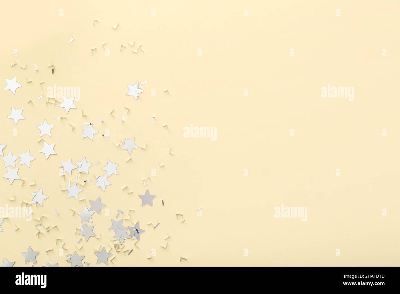 Beautiful confetti on beige background Stock Photo - Alamy