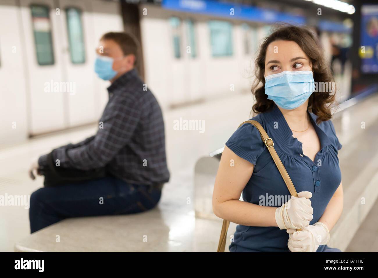 Woman in personal protective equipment at metro station Stock Photo - Alamy