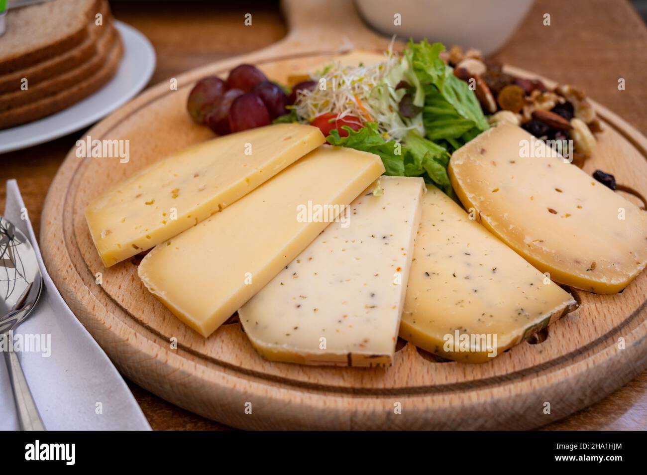 Cheese board with variety of tasty hard Belgian cheeses made in ...