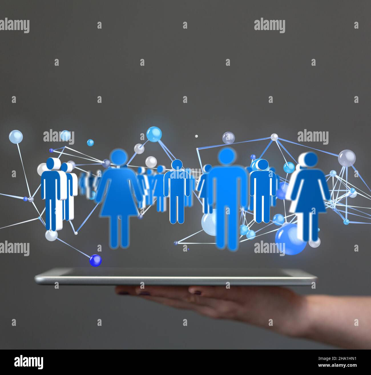 Group of 3D rendered people icons hovering over a man's hand holding a ...