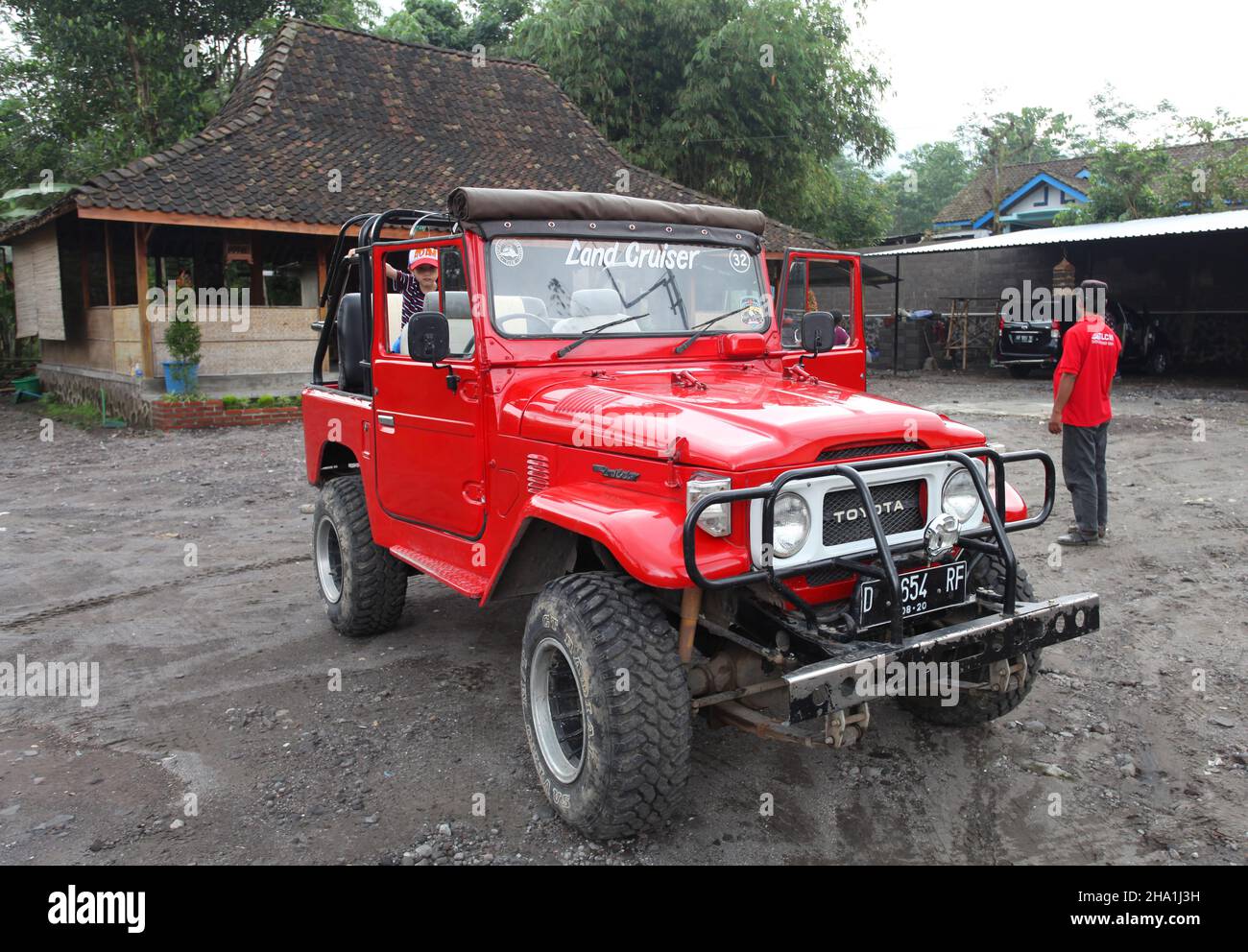 A red Toyota 4x4 jeep used for jeep tours of Mount Merapi, a frequently ...