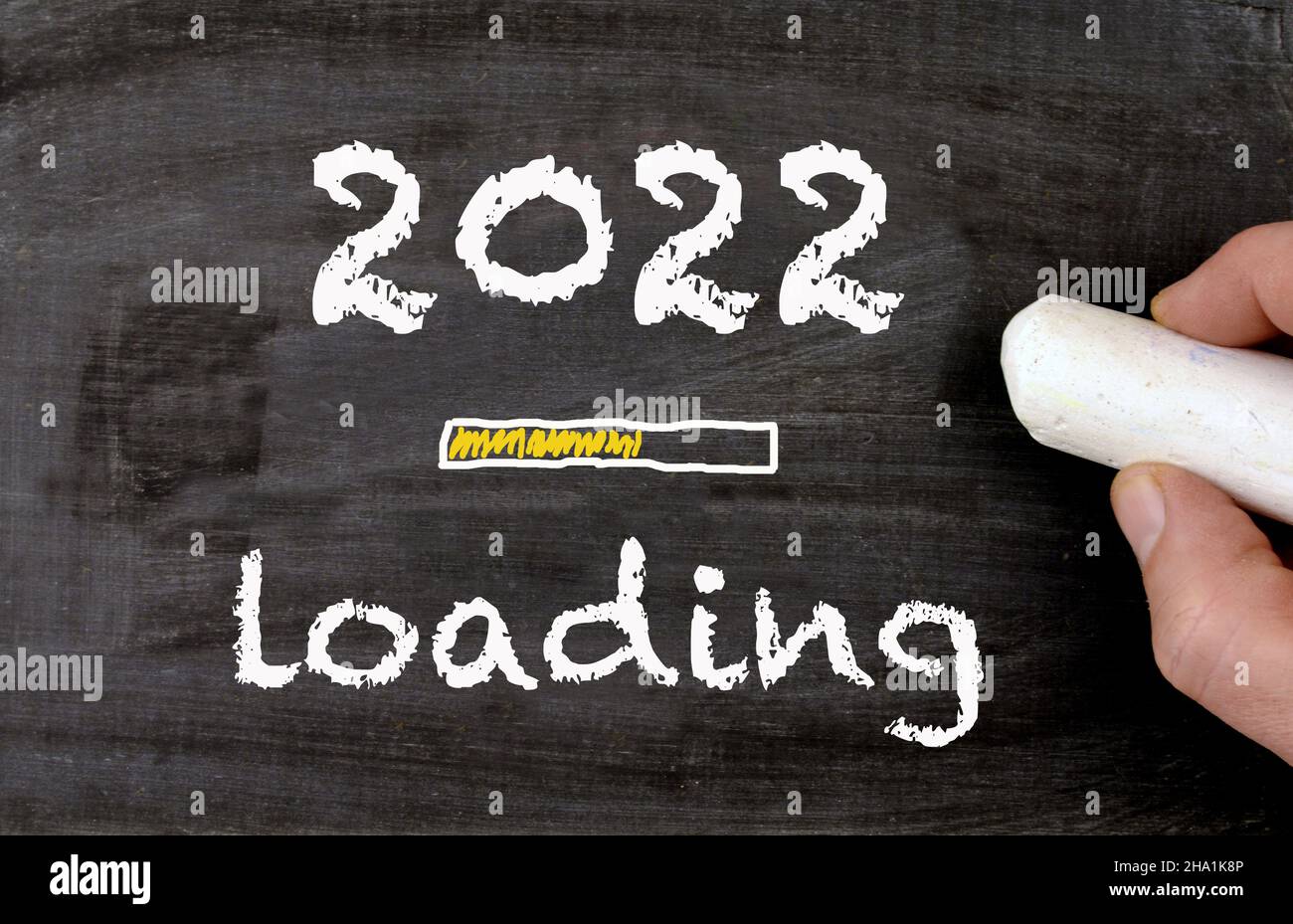 Loading the year 2022 on blackboard written Stock Photo - Alamy