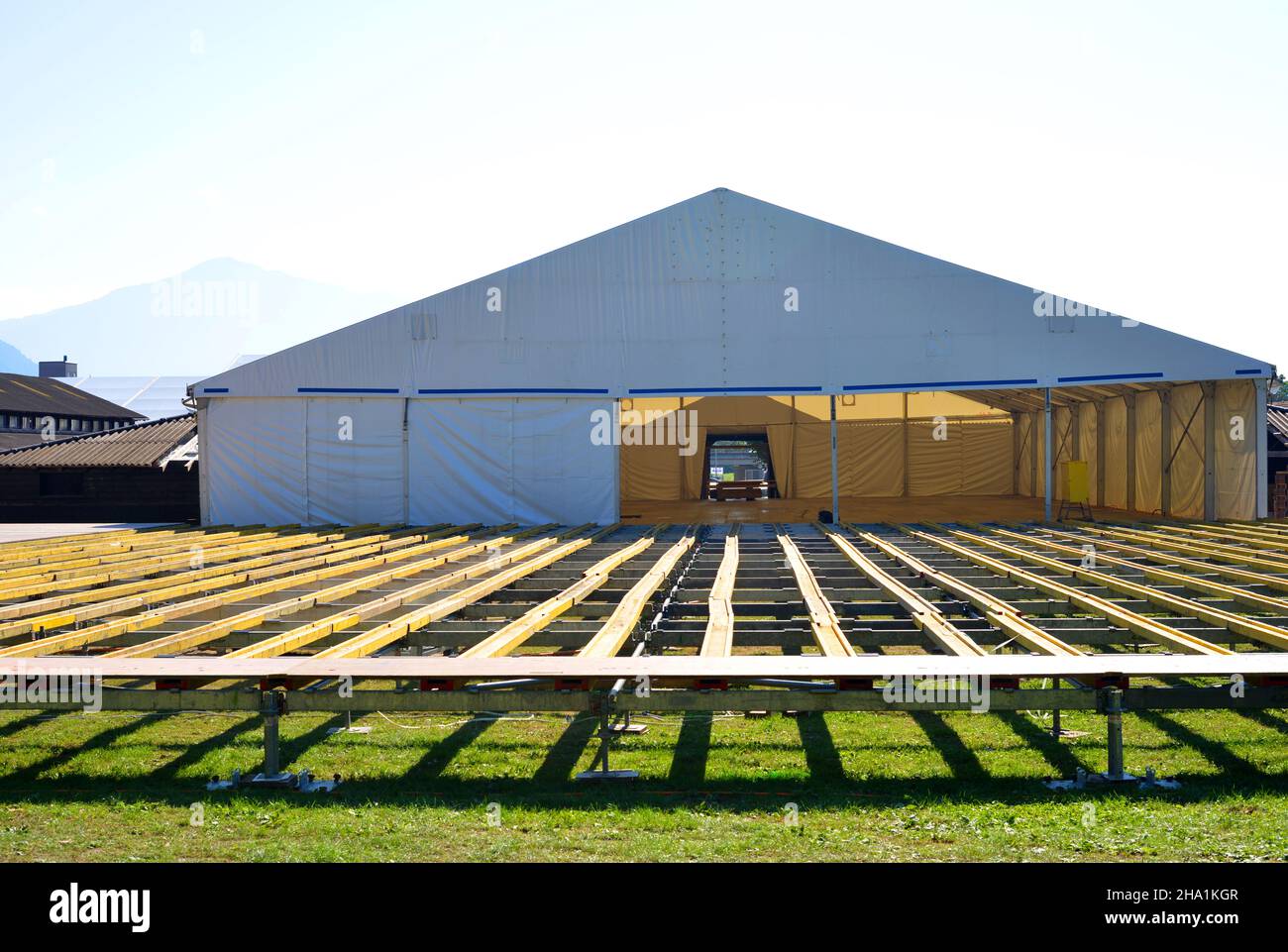 Big outdoor tent with wooden floor structure build in progress Stock ...