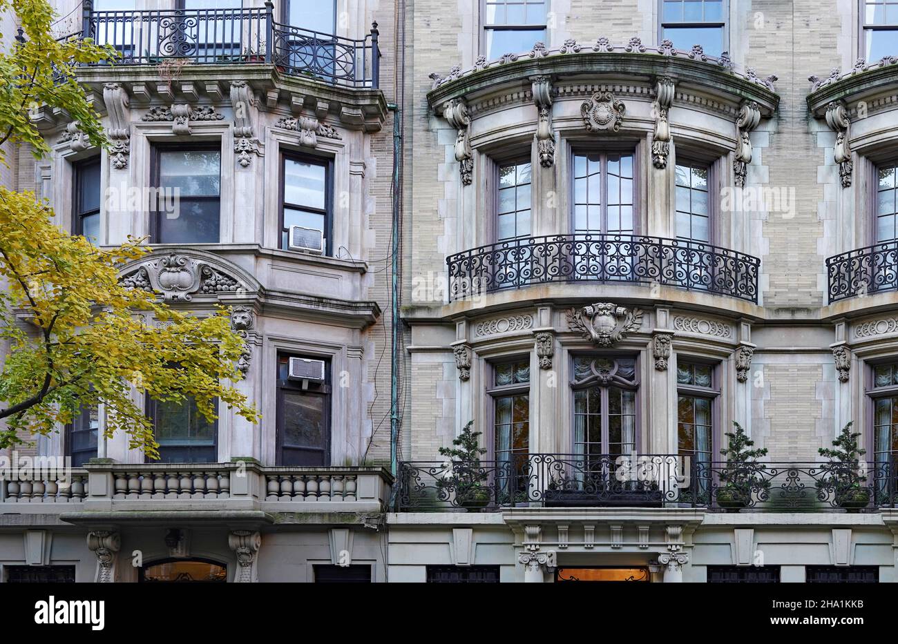 Old apartment buildings with bay windows and decorative stone carving ...