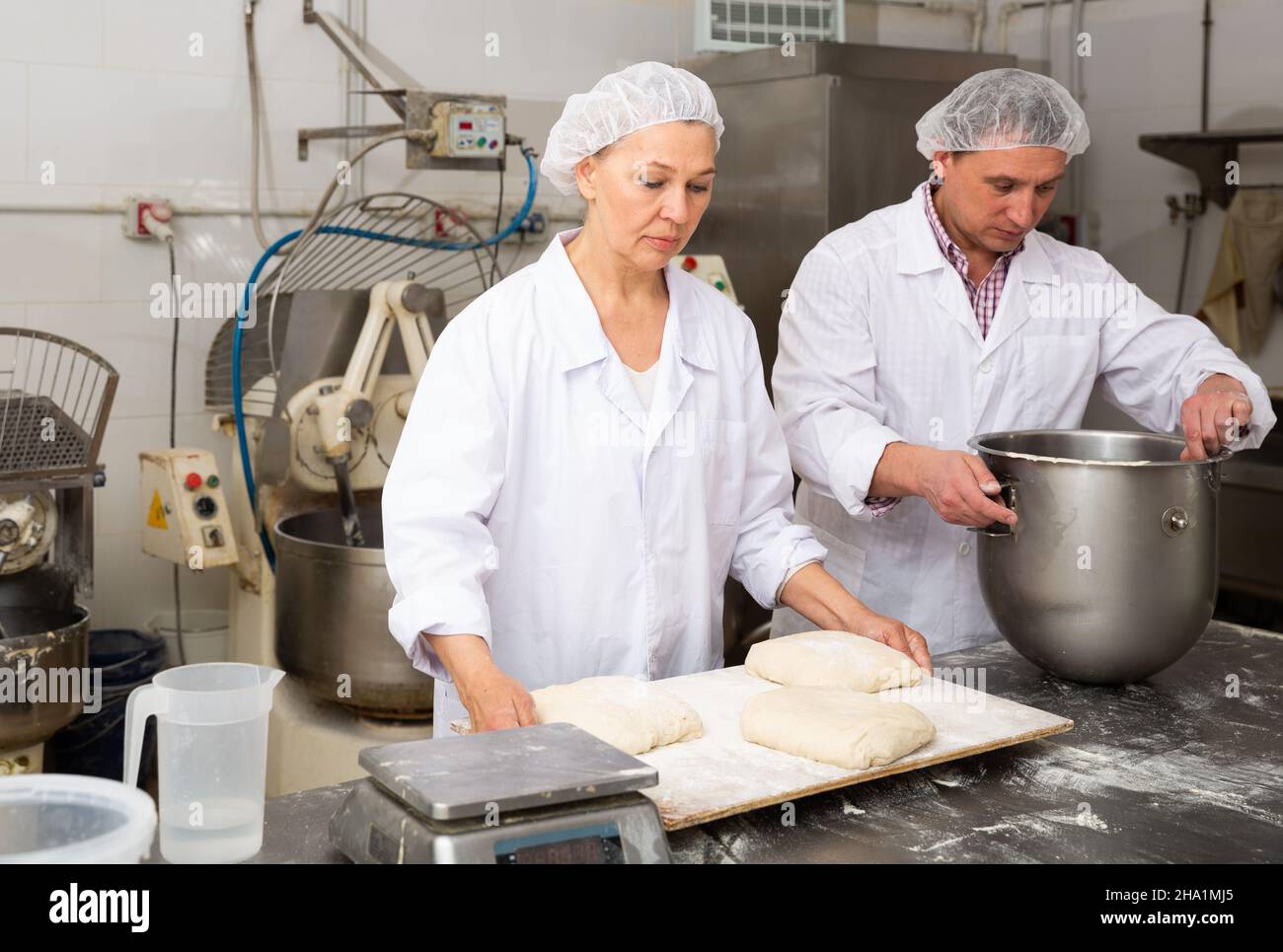 Woman kneading dough bread manufacturing hi-res stock photography and ...