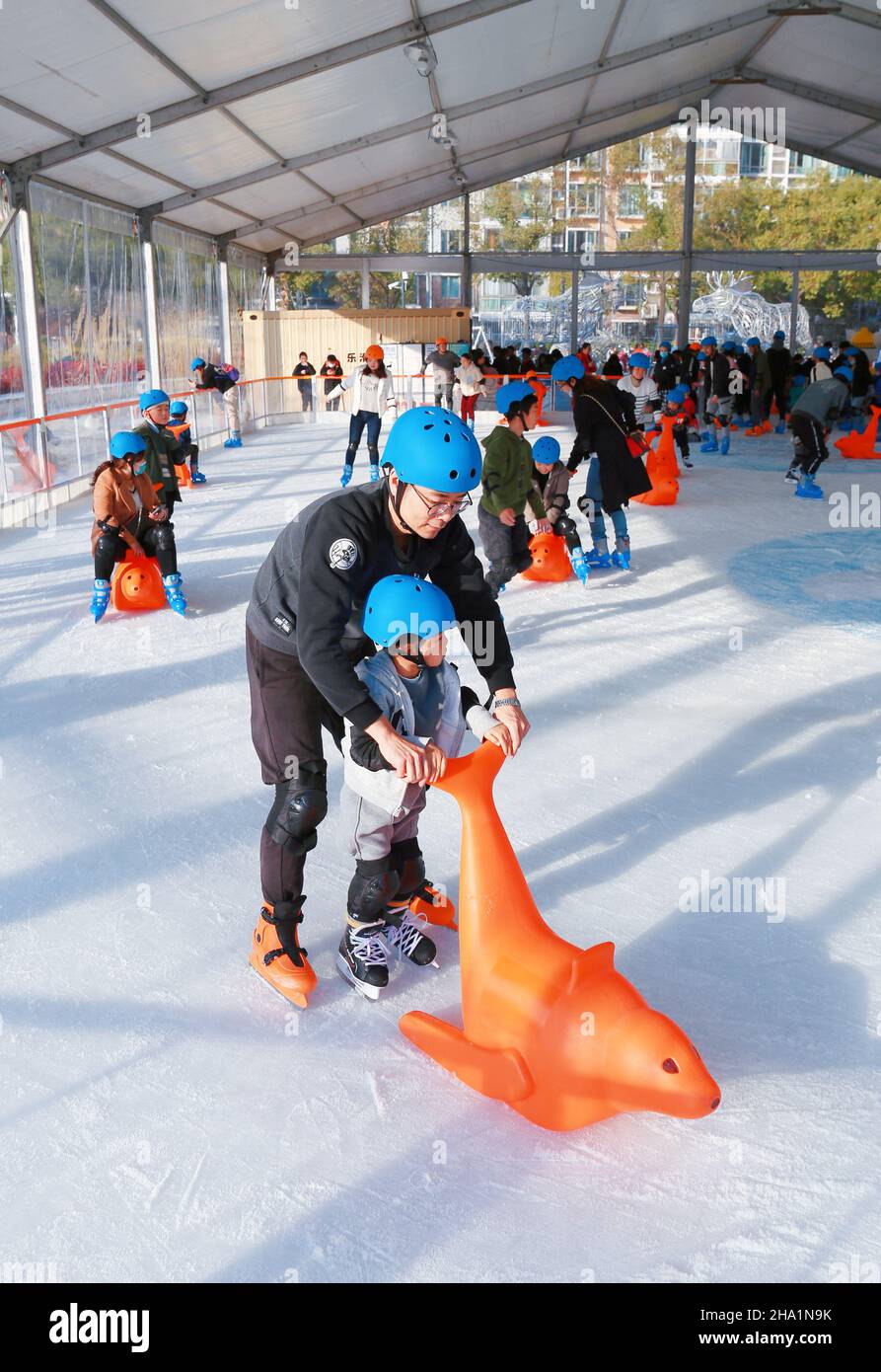 SHANGHAI, CHINA - DECEMBER 5, 2021 - Parents take their children to ...