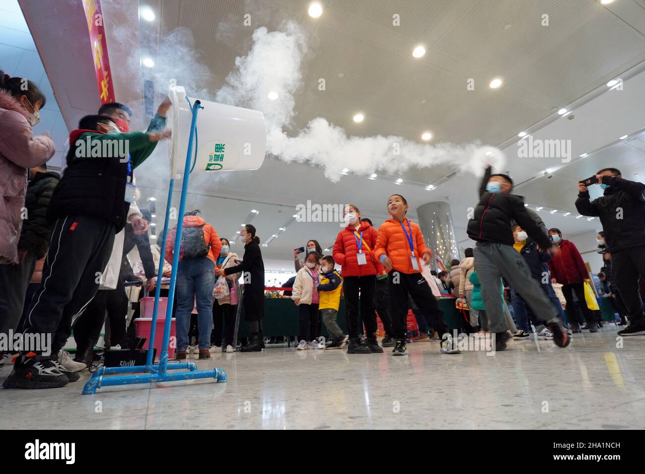 YANTAI, CHINA - DECEMBER 5, 2021 - Children experience an air cannon at ...
