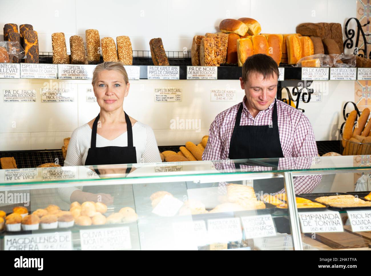 Bakers working in family bakery Stock Photo - Alamy