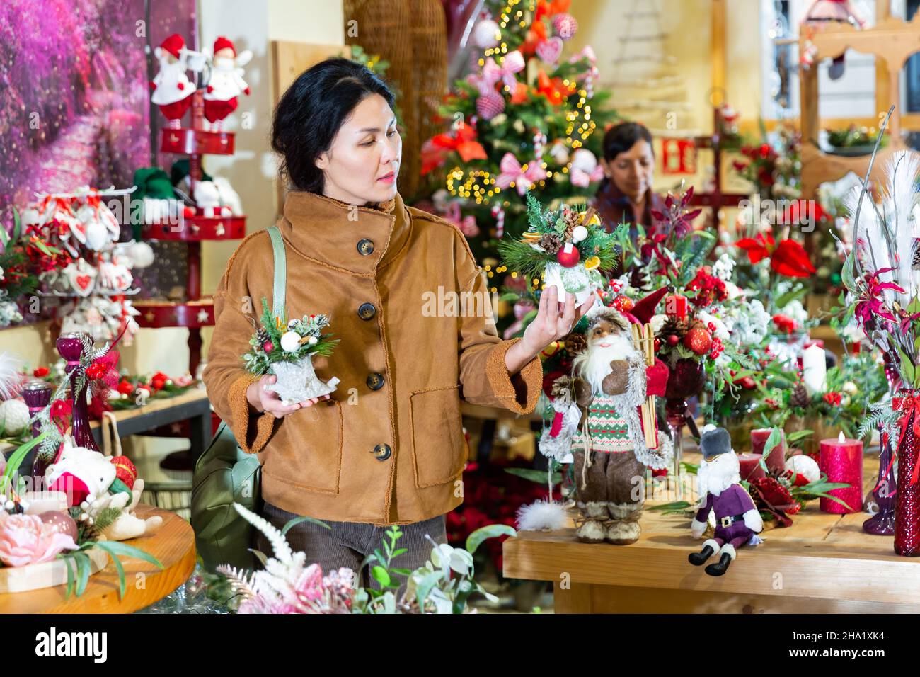 Asian female shopping Christmas decorations Stock Photo - Alamy