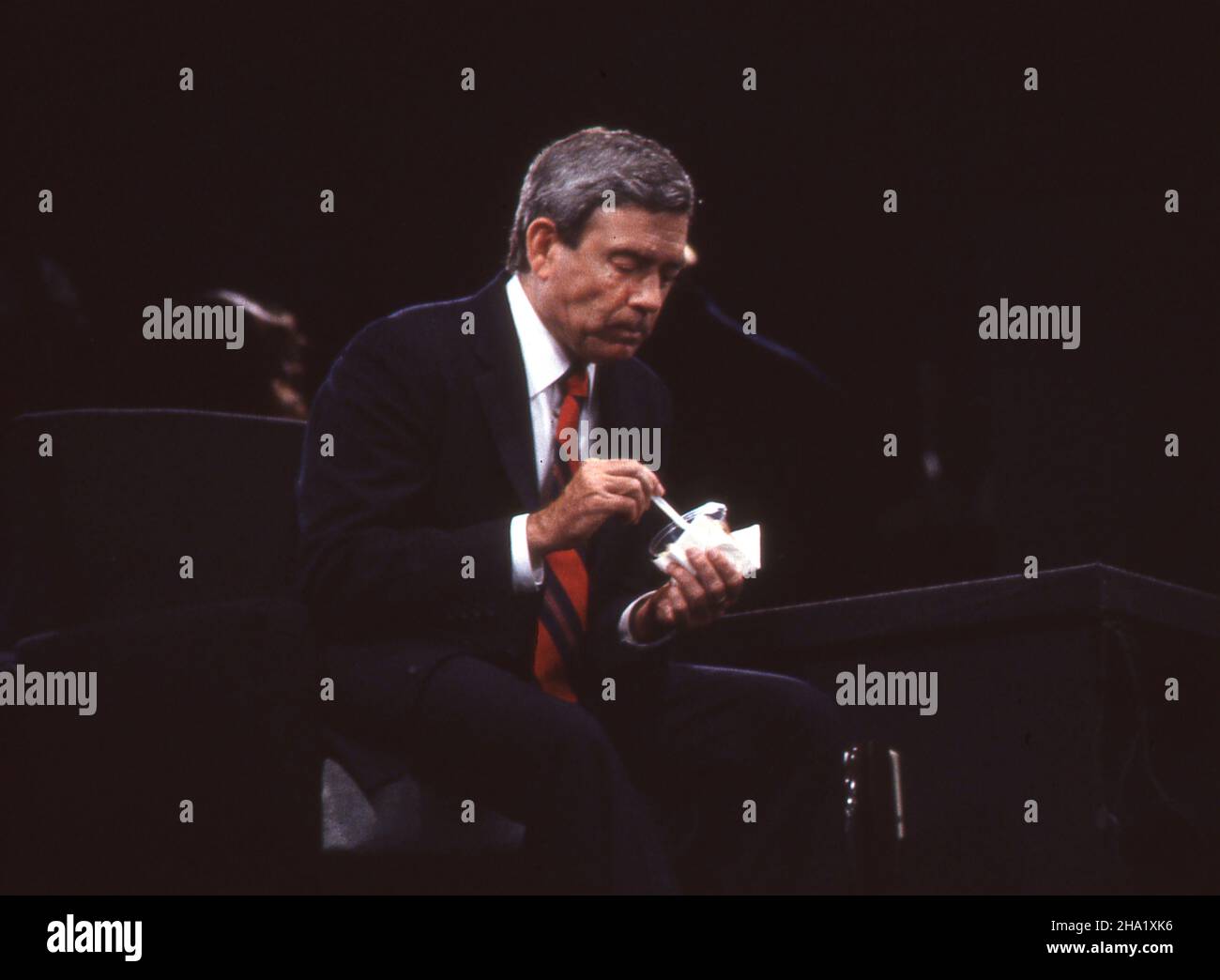 Dan Rather in the CBS anchor booth during an off air moment of the 1988 ...