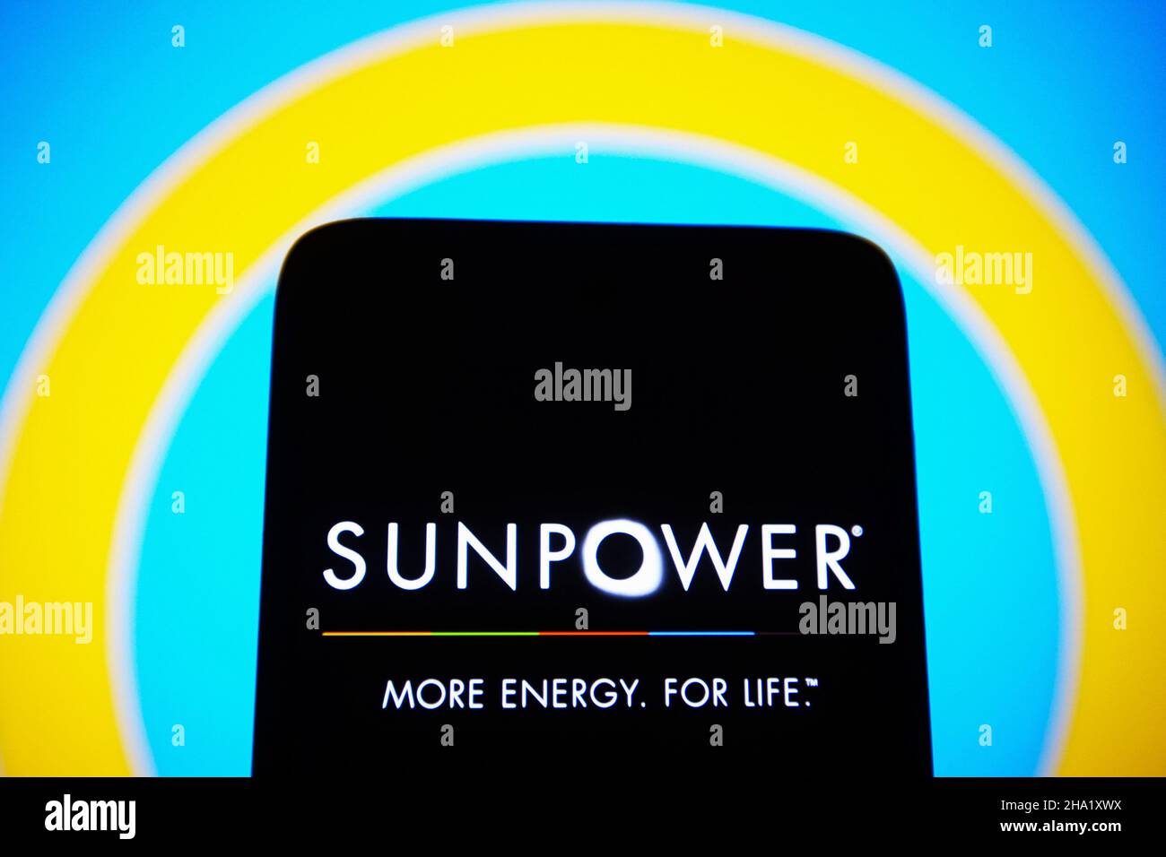 In this photo illustration, a SunPower Corporation logo of a company specializing in solar power ...