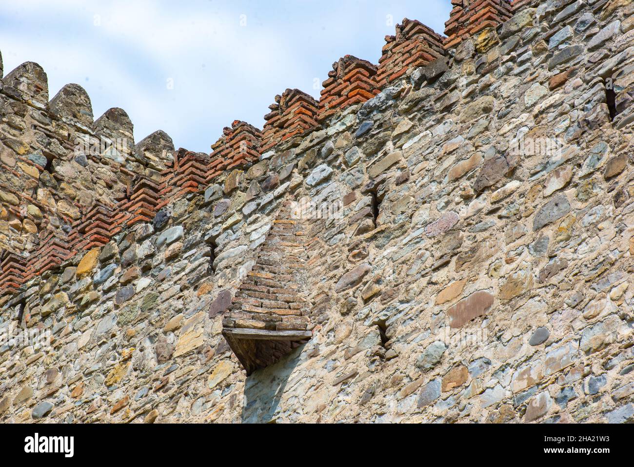 high outer fortification wall with observation windows Stock Photo - Alamy