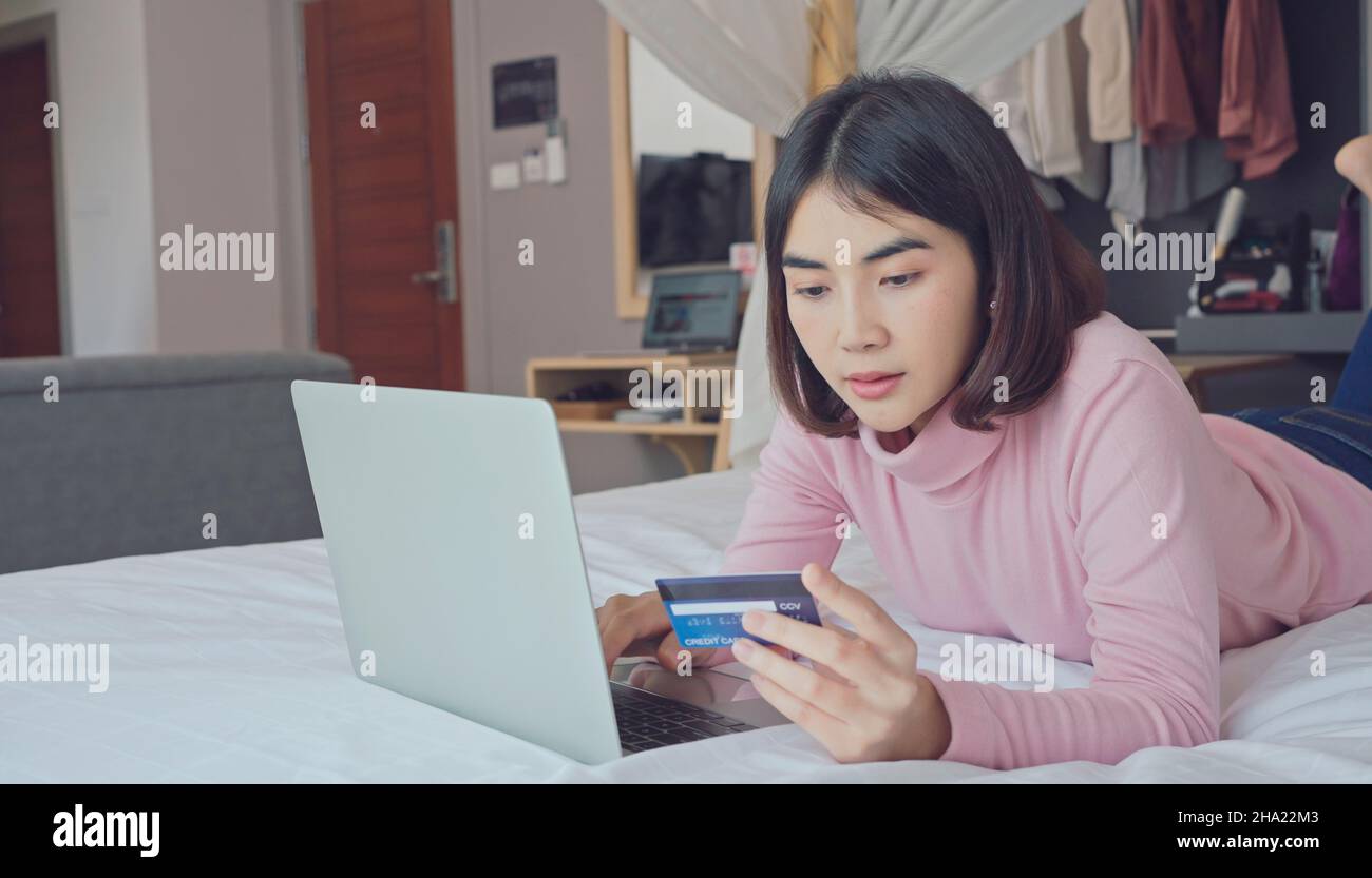 Young adult paying in bank hi-res stock photography and images - Alamy