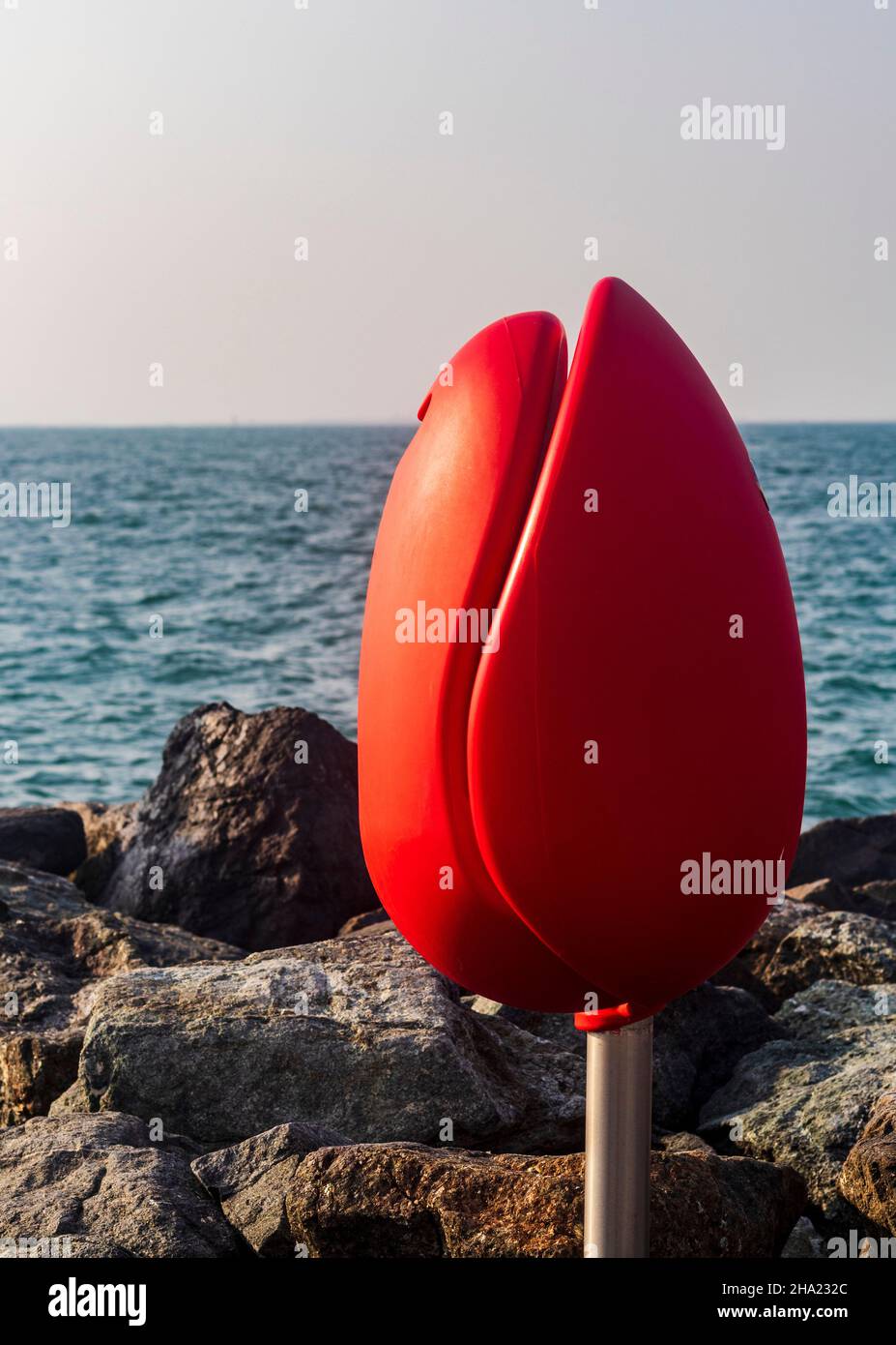 Tulip shaped outdoor chair at the beach Stock Photo - Alamy