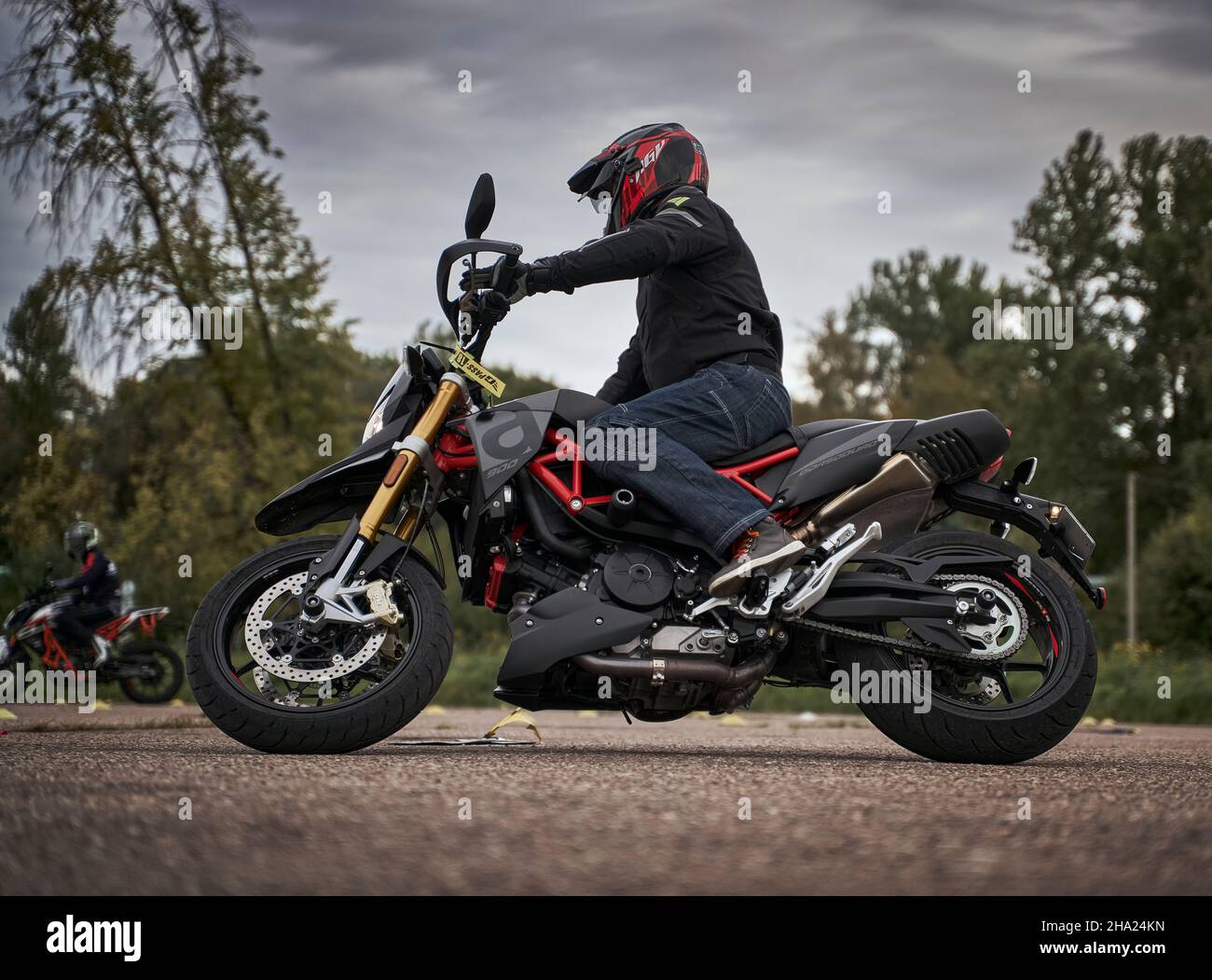 19-09-2021 Riga, Latvia A young man riding a motorcycle on an open road ...