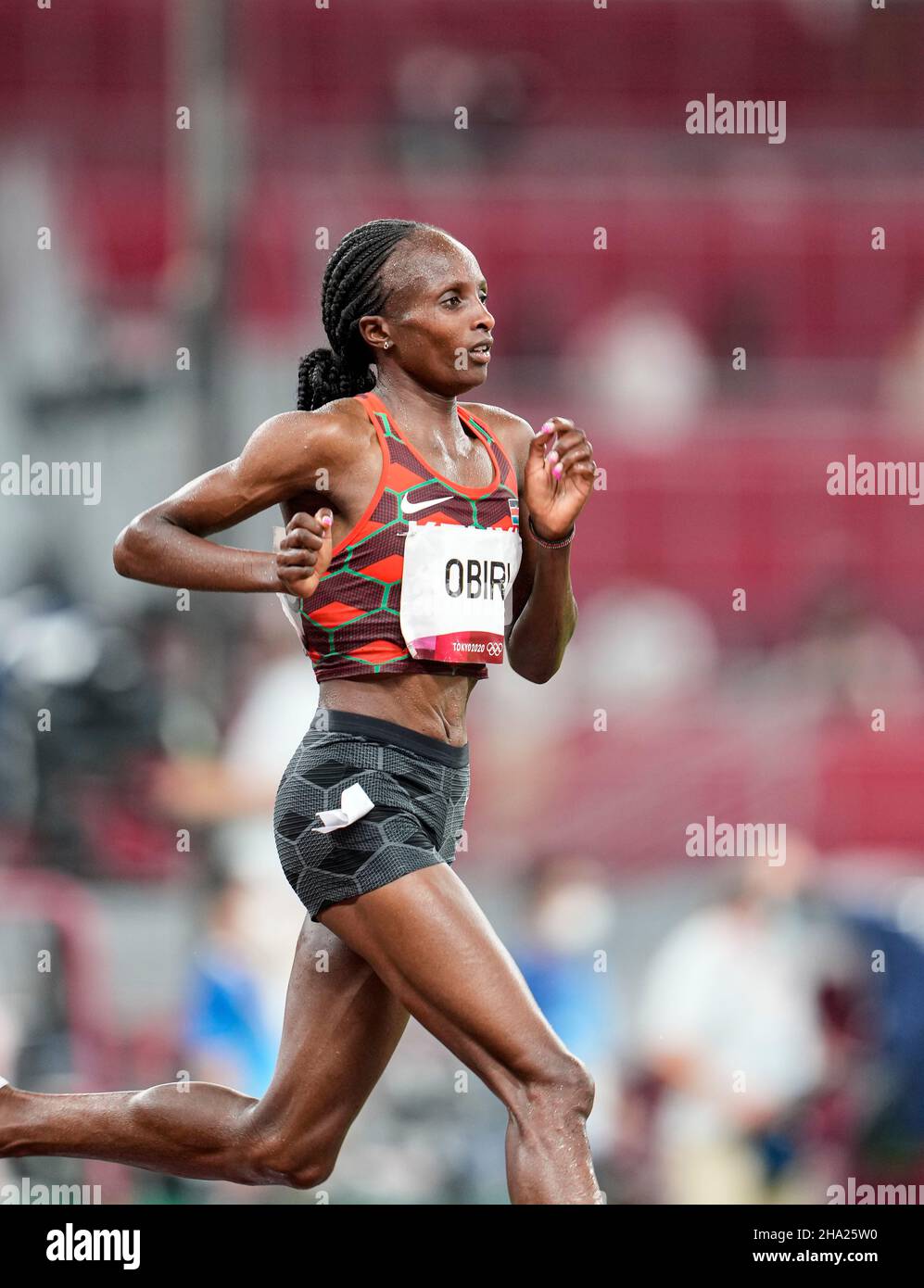 Hellen Obiri competing in the 10,000 meters of the 2020 Tokyo Olympics ...