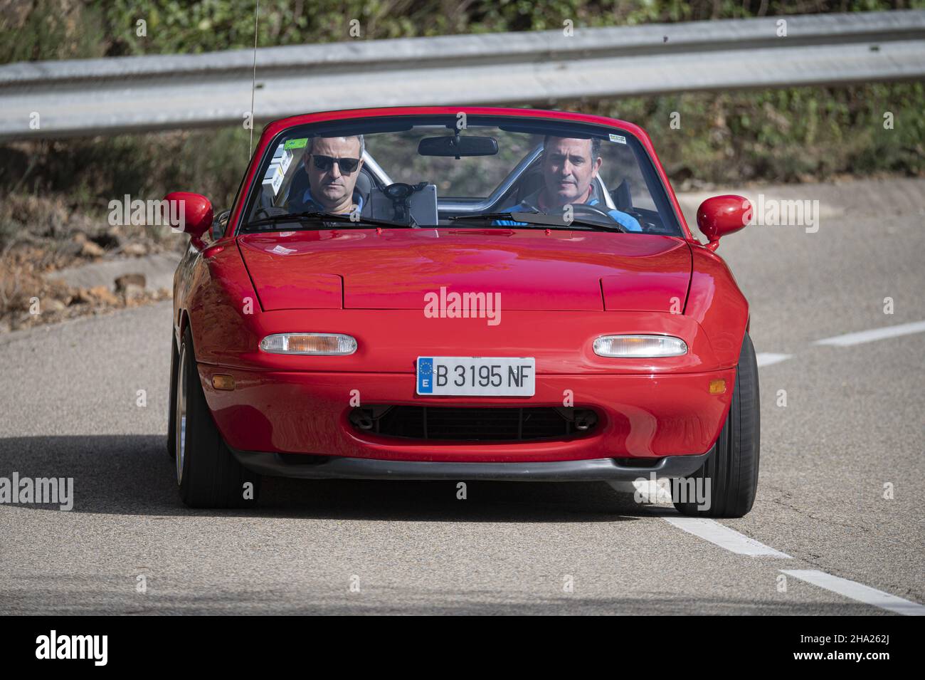 BARCELONA, SPAIN - Nov 11, 2021: A man driving Mazda MX-5 NA VIII ...