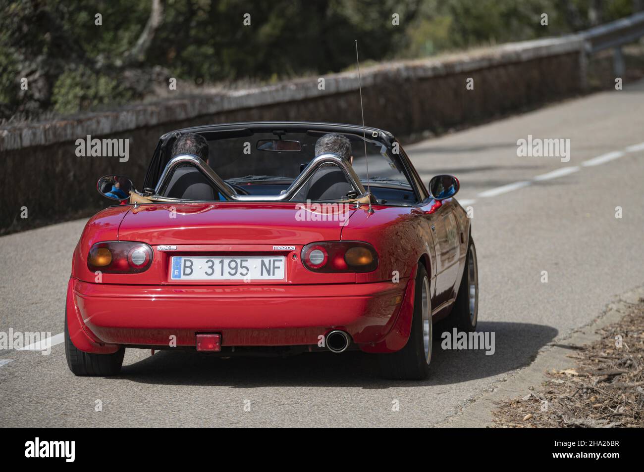 BARCELONA, SPAIN - Nov 11, 2021: A man driving Mazda MX-5 NA VIII ...
