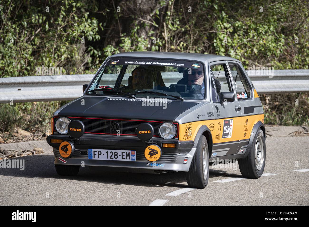 BARCELONA, SPAIN - Nov 11, 2021: A man driving Volkswagen Golf GTI Mk1 ...