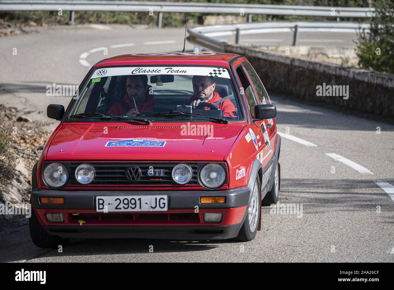 BARCELONA, SPAIN - Nov 11, 2021: A man driving Volkswagen Golf GTI Mk2 ...