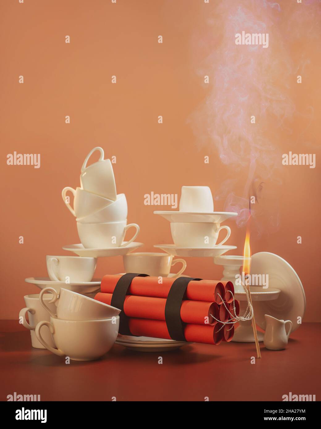 Dynamite in a stack of porcelain cups, conceptual still life with an ...