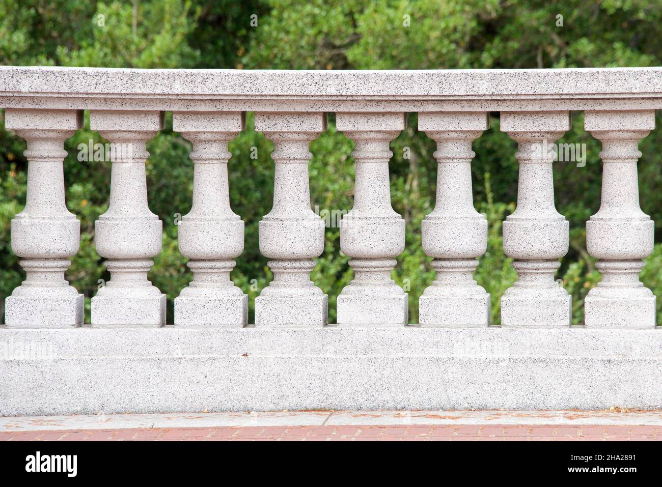 Ornate balcony pillars, close up with greenery in background Stock ...