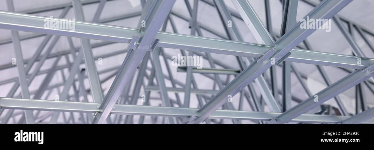 Metallic modern construction of roof overlap of the building closeup ...