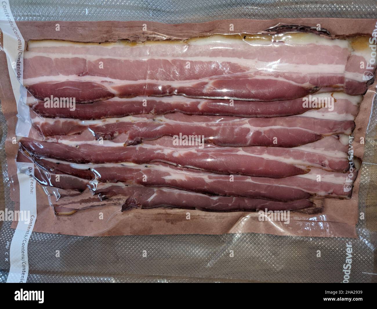 Slices of vacuumed raw bacon Stock Photo - Alamy