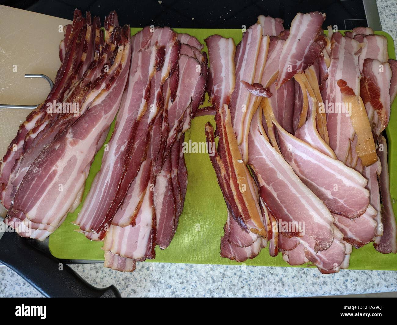Slices of a raw bacon Stock Photo - Alamy
