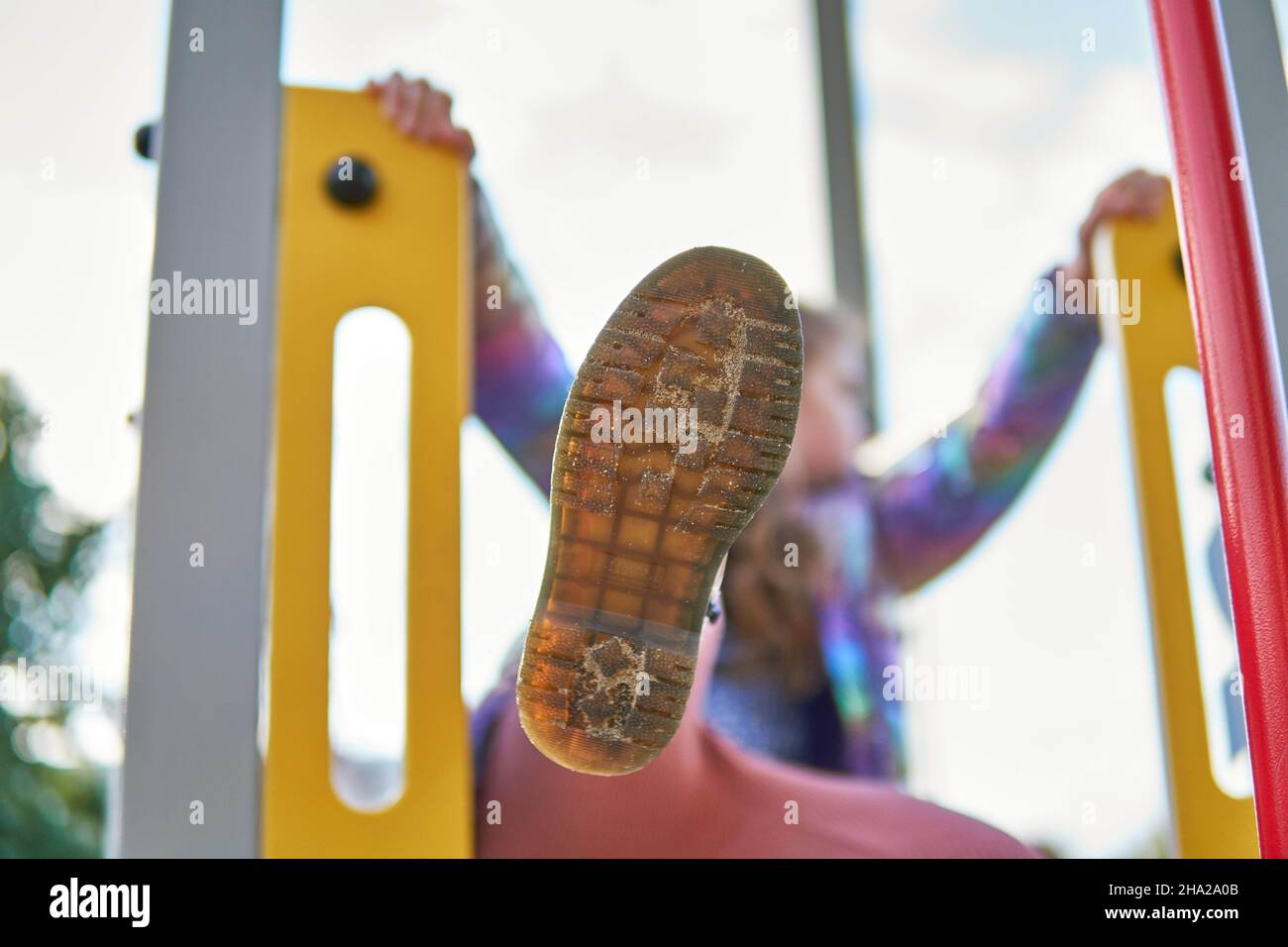 Low angle of a Child's foot in front of a playground Stock Photo - Alamy