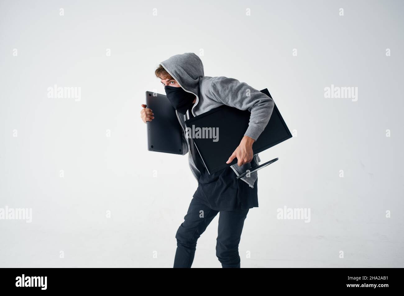 male thief stealth technique robbery safety hooligan light background ...